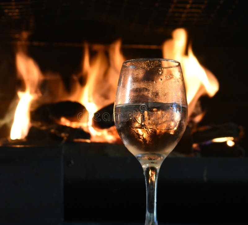 A Wine Glass in Front of the Fire Stock Photo - Image of christmas ...