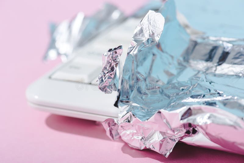Focus of Computer Keyboard Wrapped in Silver Foil on Pink, Chocolate ...