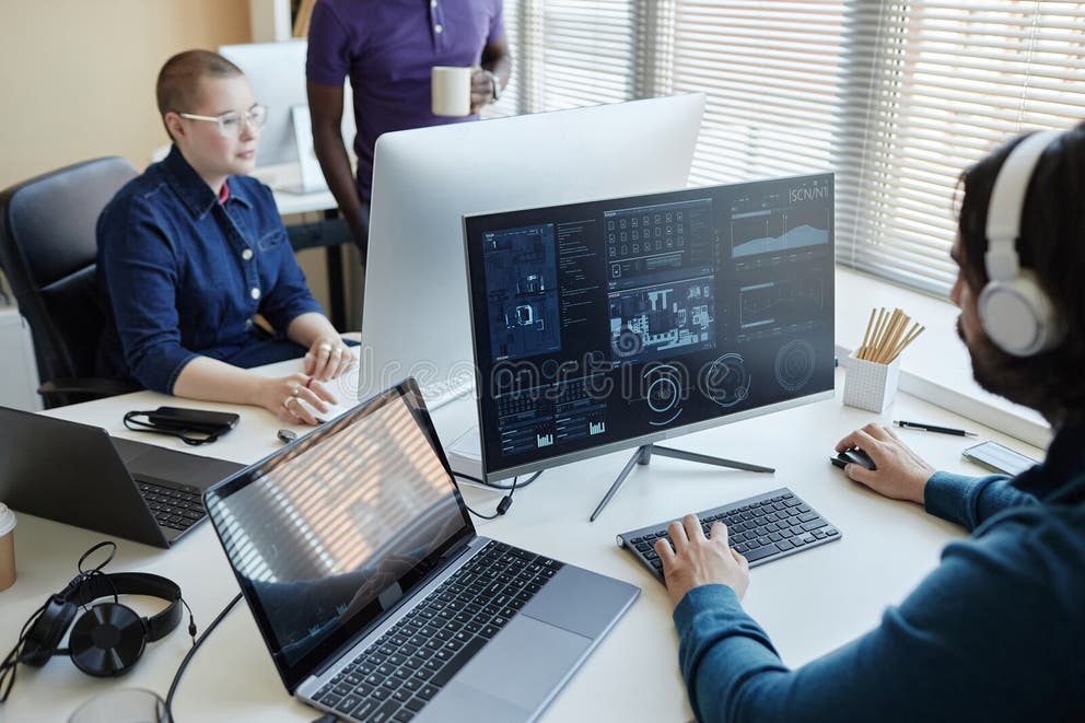 Focus on Computer Screen with Cyber Data and Laptop on Workplace of ...