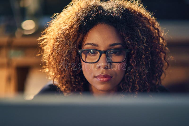 Focus Determines Success. a Young Businesswoman Using a Computer during ...