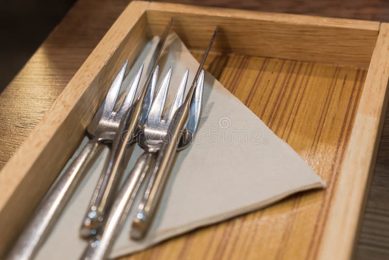 Focus on the Forks and Knives in Wooden Tray Stock Image - Image of ...