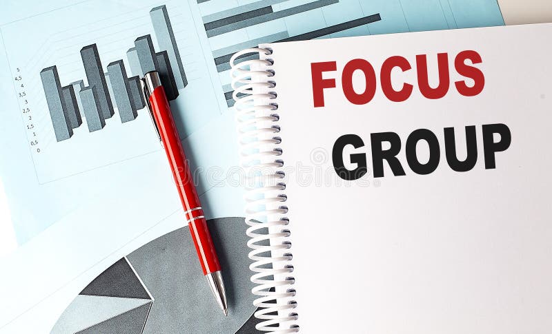 FOCUS GROUP Text on a Notebook with Pen on a Chart Background Stock ...