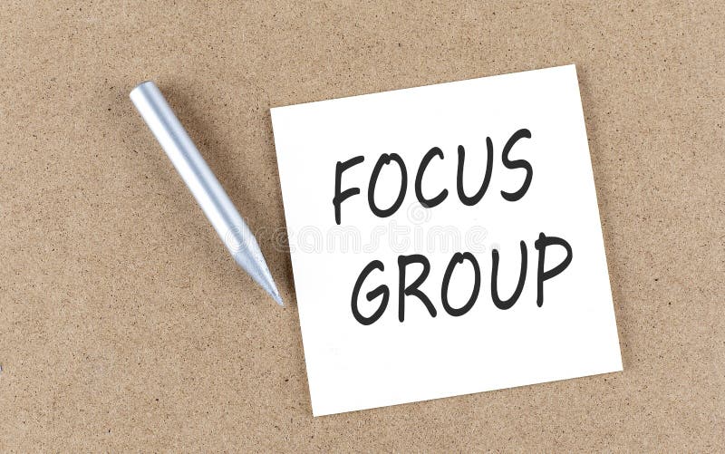 FOCUS GROUP Text on Sticky Note on a Cork Board with Pencil Stock ...