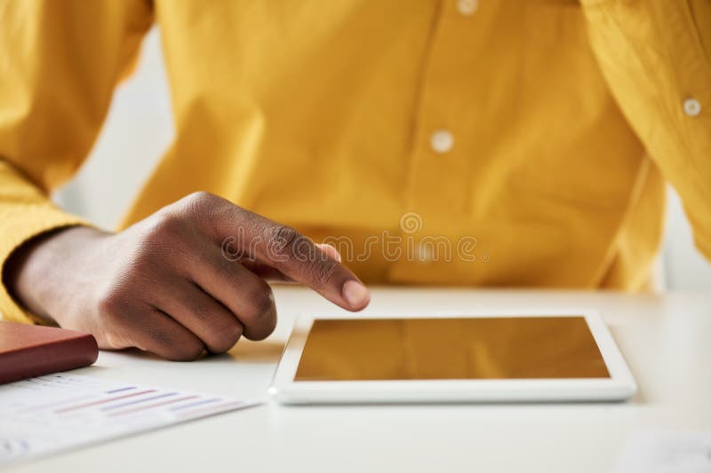 Focus on Hand of Black Guy Pointing at Screen of Tablet on Desk Stock ...