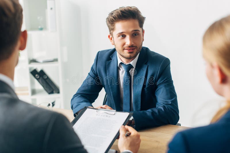 Focus of Handsome Employee Looking at Recruiter during Job Interview ...