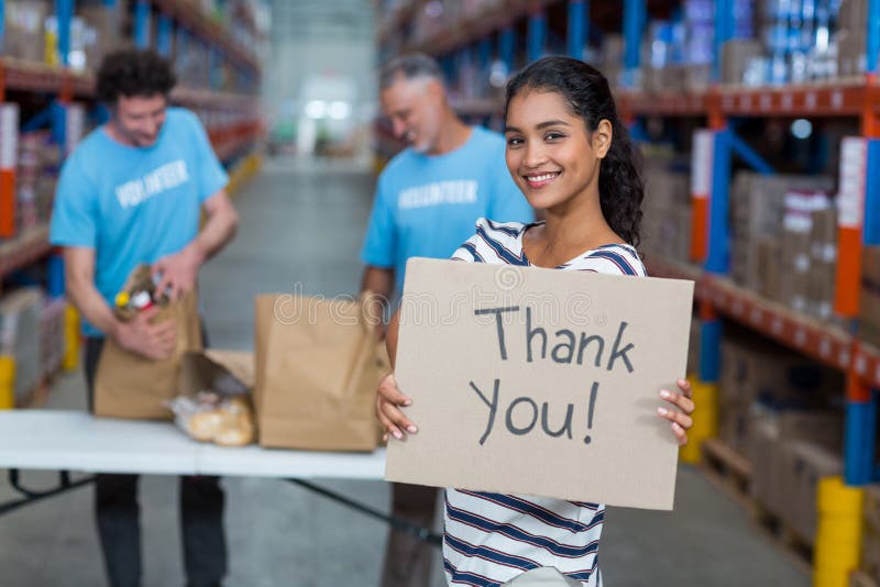 Focus of Happy Volunteer Posing and Holding a Sign Stock Photo - Image ...