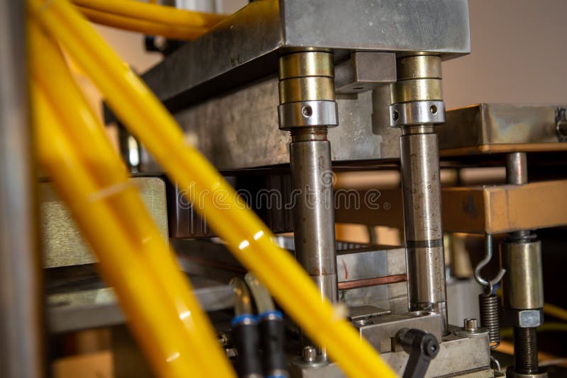 Focus on the Hydraulic Press on the Plastic Packaging Machine. Industry ...