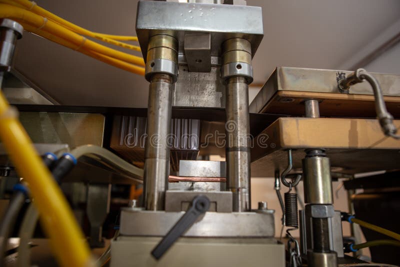 Focus on the Hydraulic Press on the Plastic Packaging Machine. Industry ...