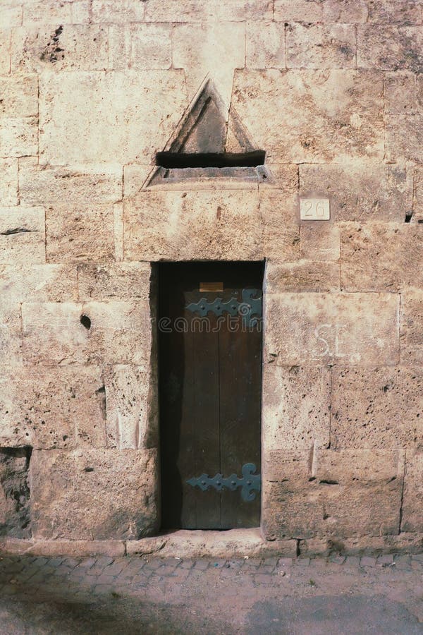 Triangular Stone Window Above a Historic Wooden Door Stock Photo ...