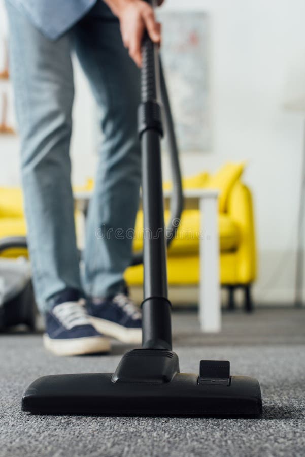 Focus of Man Using Vacuum Cleaner Stock Photo - Image of cropped ...