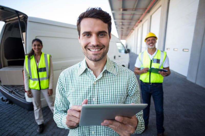 Focus of Manager is Holding a Tablet in Front of His Colleagues Stock ...