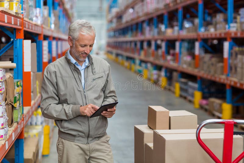 Focus of Manager is Looking a Tablet and Smiling Stock Image - Image of ...