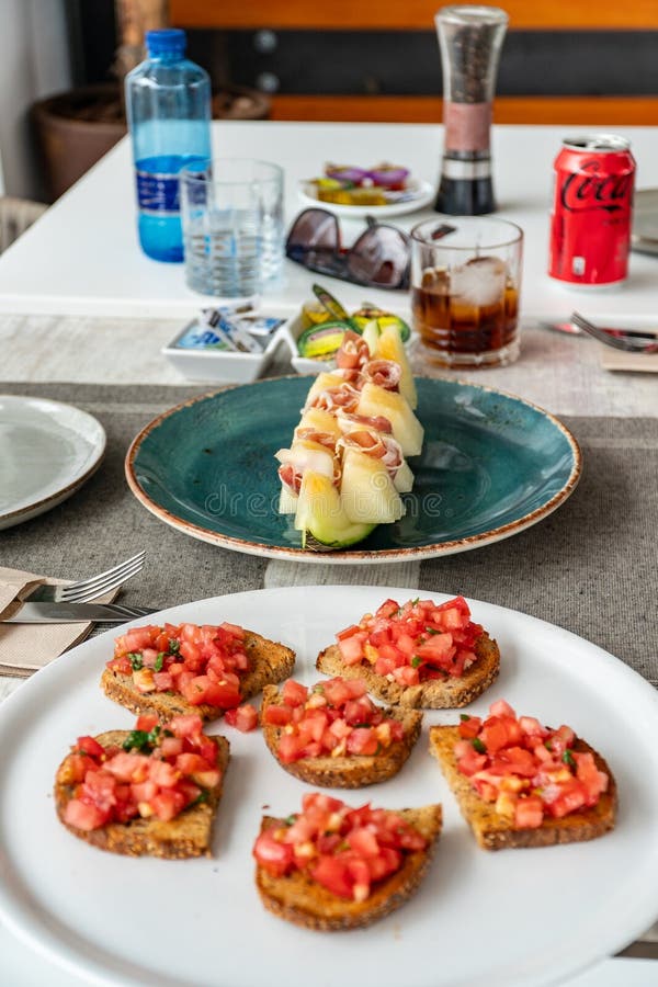 Focus on the Melon and Jam on a Mediterranean Table Stock Image - Image ...