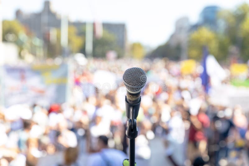 Protest or Public Demonstration, Focus on Microphone, Blurred Crowd of ...