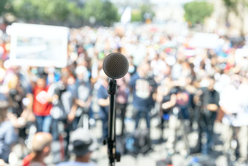 Political Protest. Demonstration. Microphone in Focus Against Bl Stock ...