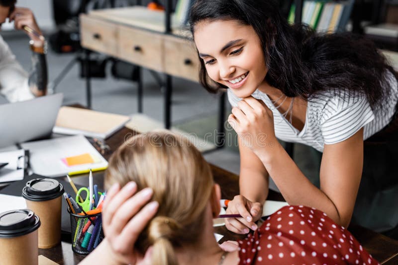 Focus of Multiethnic Students Smiling and Looking at Each Other Stock ...
