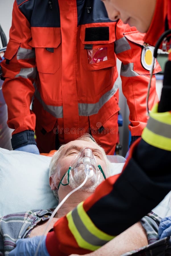 Focus of Paramedic Wearing Oxygen Mask Stock Image - Image of inside ...