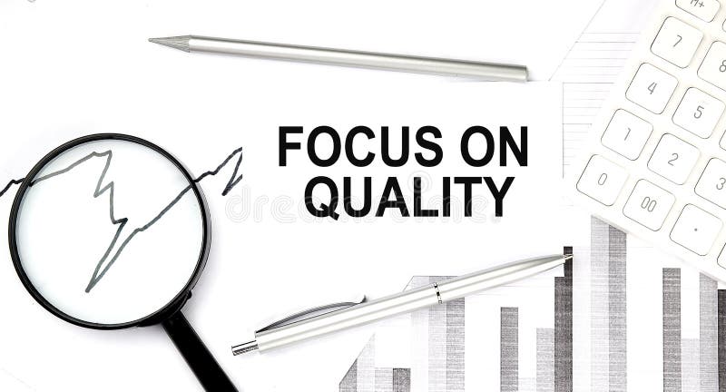 FOCUS on QUALITY Document with Pen,graph and Magnifier, Calculator ...