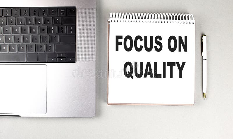 Focus on Quality Message on Notepad Next To Laptop Symbolizing Business ...