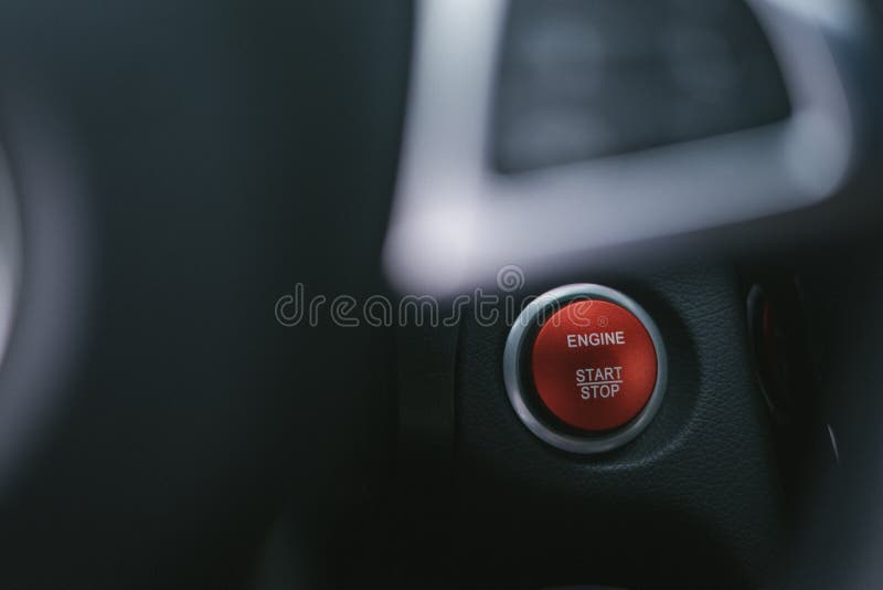 Focus on Red Start Stop Button in Car with Unfocused Steering Wheel ...