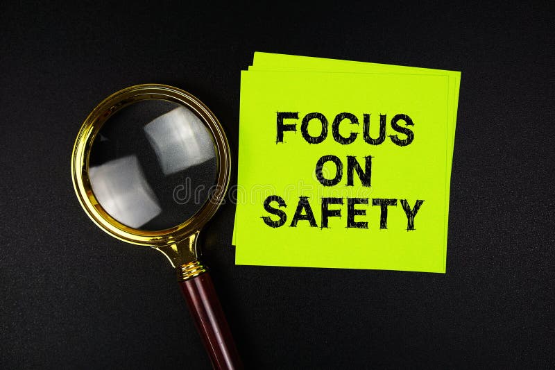 Focus on Safety Text on Sticky Note with Magnifying Glass on Black ...