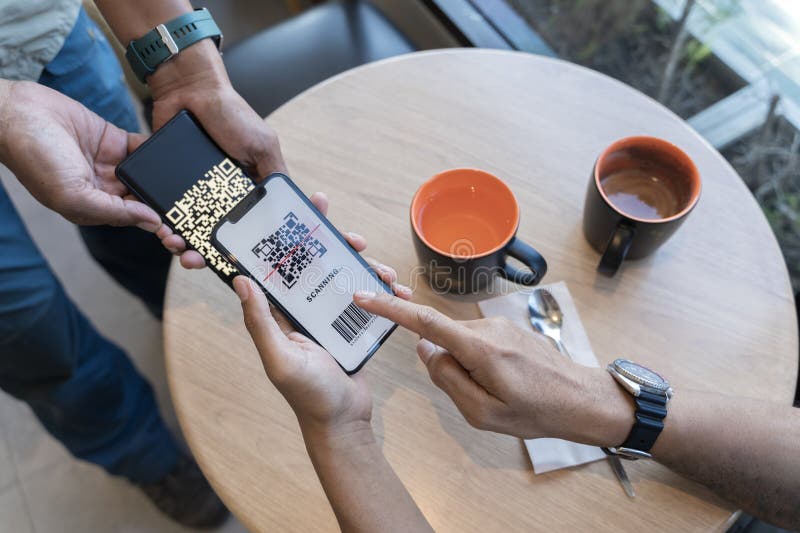 Focus on Scan Here To Pay Text. Close Up of Hands Scaning QR Code for ...