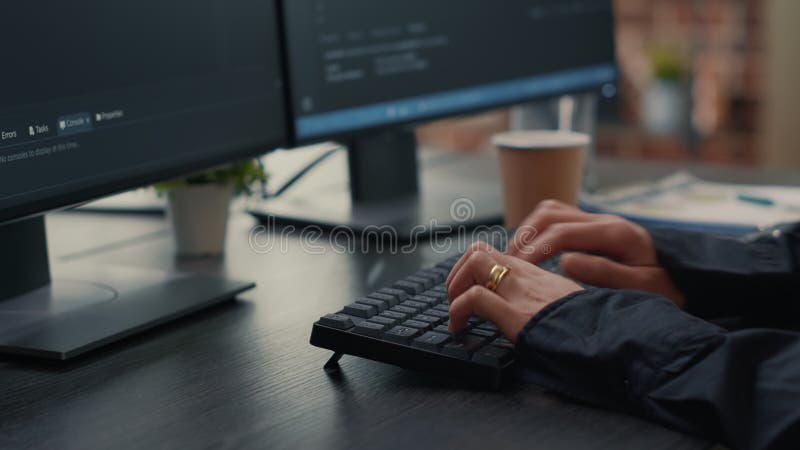 Focus On Software Developer Hands Typing Source Code On Keyboard While Looking At Computer