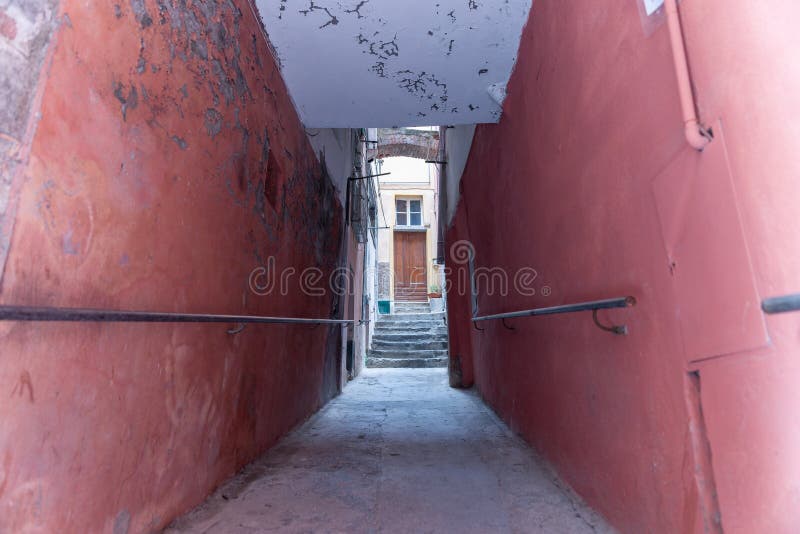 Focus on Steps and Door at End of Long Pink Alleyway Stock Image ...