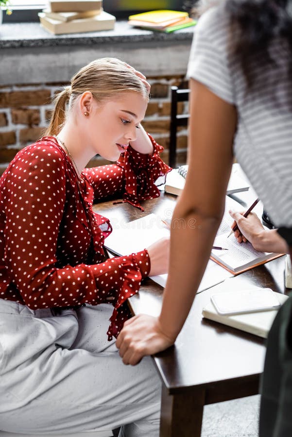 Focus of Student in Red Blouse Looking at Notebook Stock Photo - Image ...