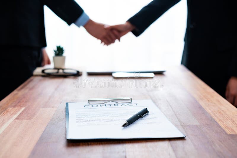 Focus Table Top View of Contract Document on Meeting Table. Jubilant ...