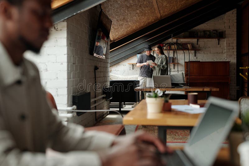 Focus on Two Young Analysts or Managers Looking at Screen of Tablet ...