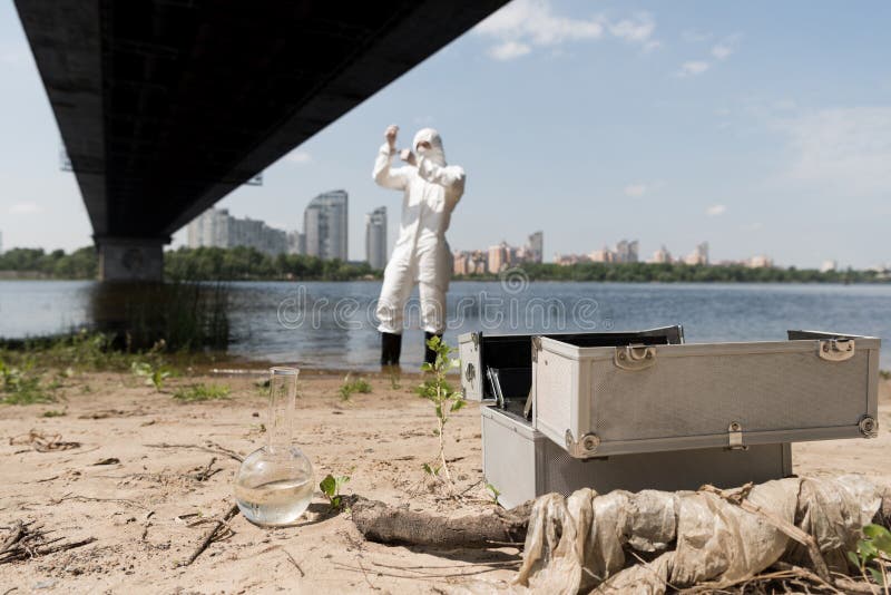 Focus of Water Inspector in Protective Costume and Inspection Kit with ...