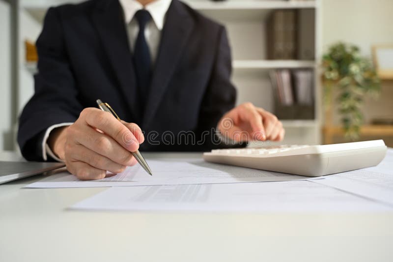 Focused Accountant in Black Suit Analyzing Financial Data at Office ...