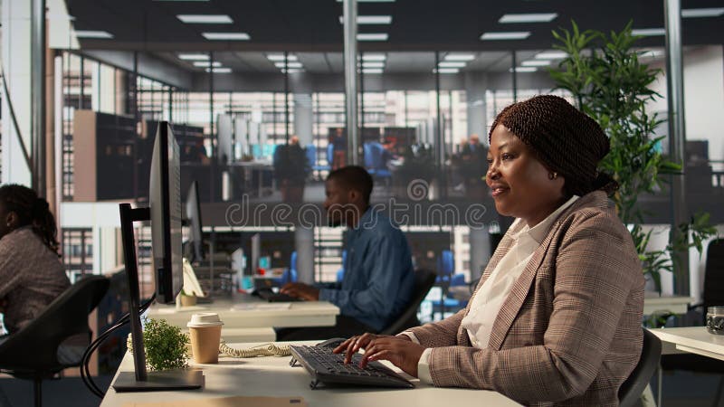 Focused African American General Manager Multitasking at Desk To Solve ...