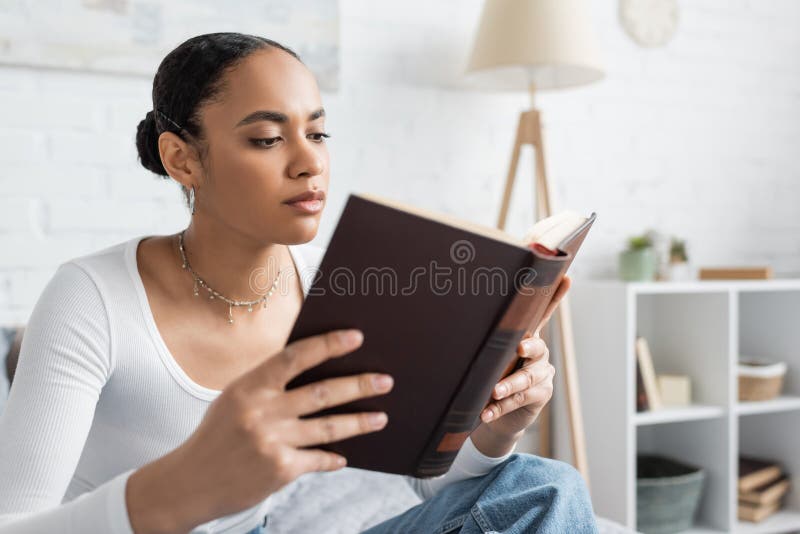Focused African American Student Reading Book Stock Image - Image of ...