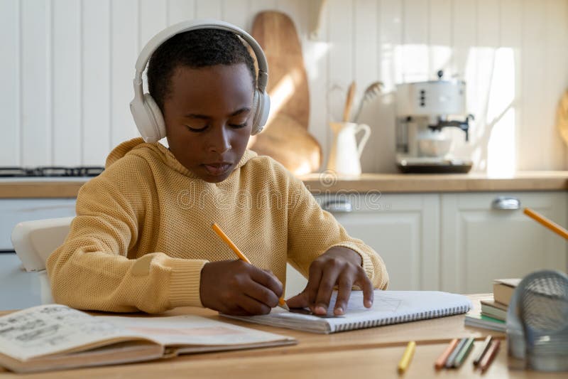 Focused African Child Boy Sitting at Desk Working on Engineering ...