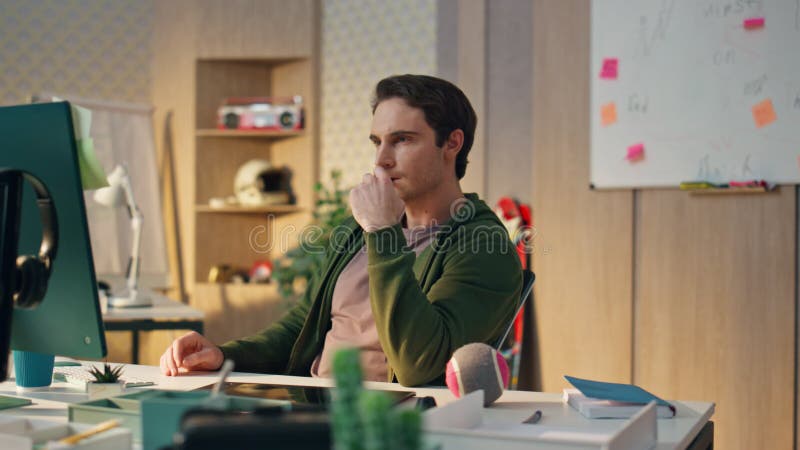 Focused Artist Staring Computer Display in Evening Office. Serious Man ...