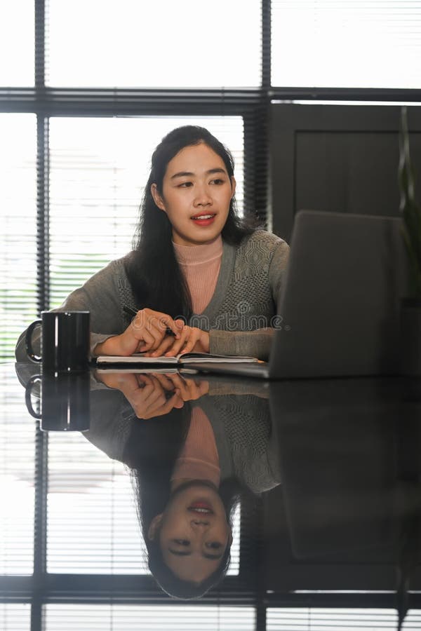Focused Asian Woman Looking at Computer Tablet while Studying Online on ...