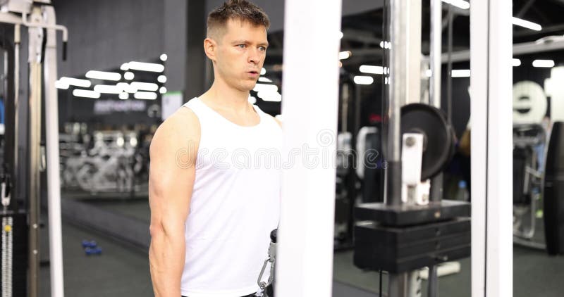 Athlete Strengthens Triceps Muscles Using Cable Machine Stock Video ...