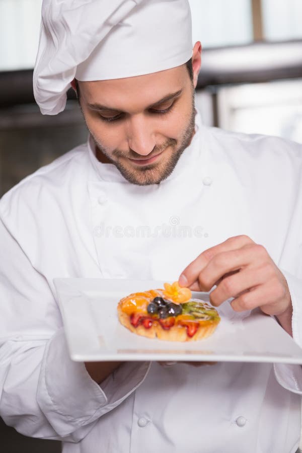 Focused Baker Putting Flower on the Pastry with Fruit Stock Image ...