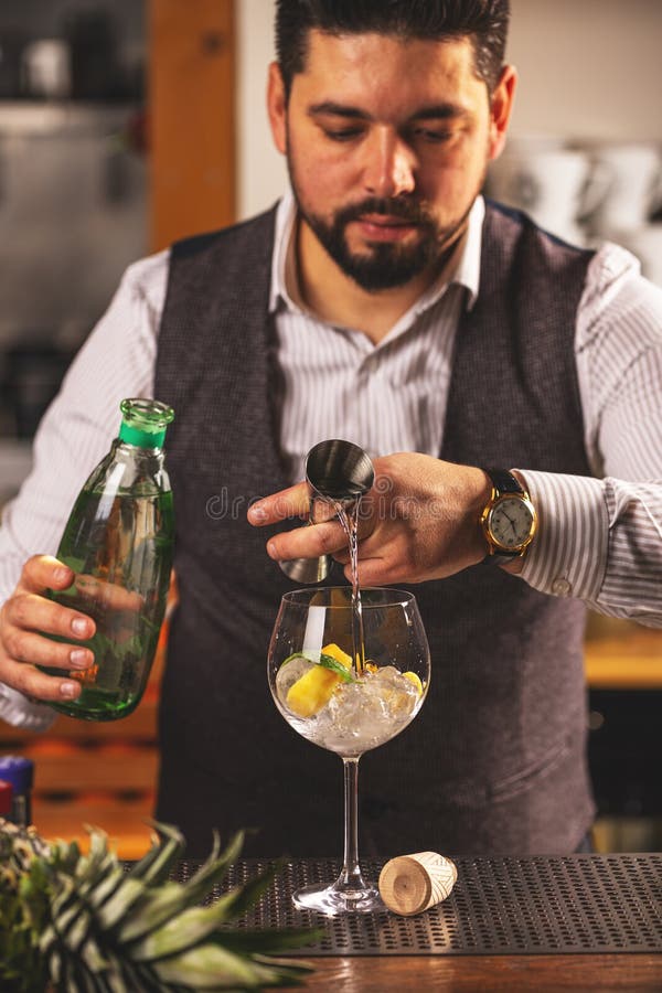 Bartender Pouring Gin into Glass with Ice Stock Image - Image of ...