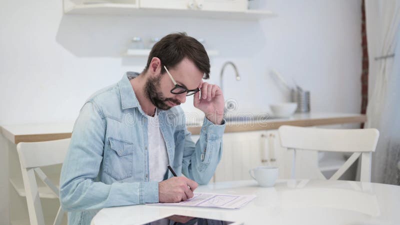 Focused Beard Young Man Writing on Paper Stock Photo - Image of book ...