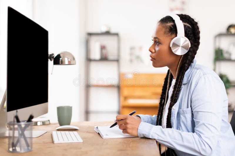 Focused Black Lady Student Working at Her Desk with Computer Stock ...