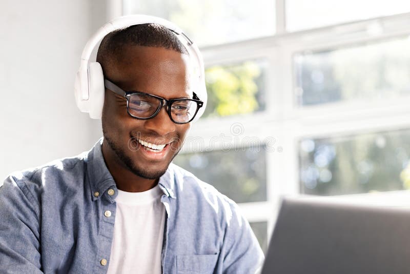 Focused Black Man Utilizing Digital Tools for Online Education Stock ...