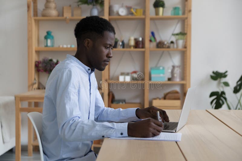 Focused Black Student Guy Watching Learning Webinar on Laptop Stock ...