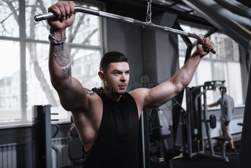 Muscular Bodybuilder Working Out at Gym Stock Photo - Image of back ...