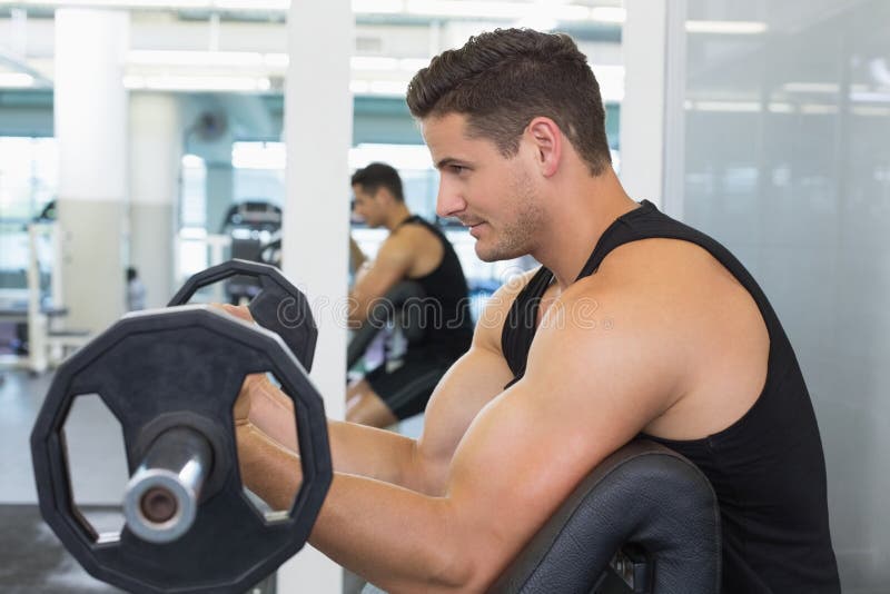 Focused Bodybuilder Lifting Heavy Black Barbell Stock Image - Image of ...