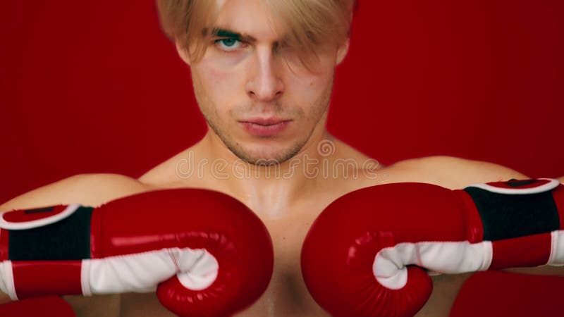 A Boxer Prepares for a Match with Determination in a Red Training ...