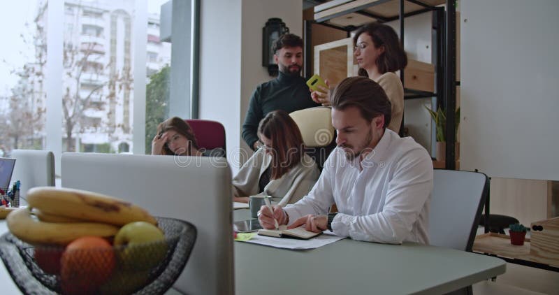 Focused Business Employees Collaborating on a New Project Strategy in a ...