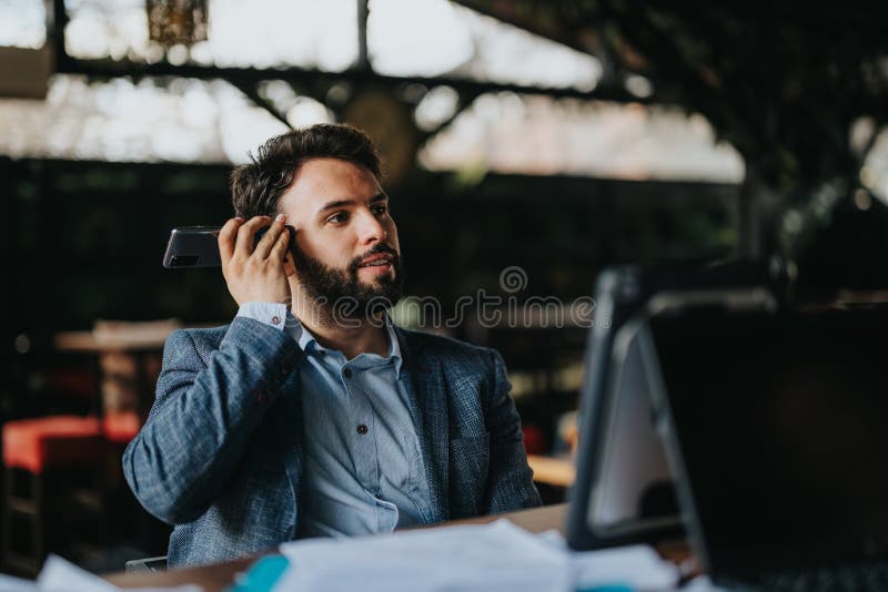 Business Entrepreneur Working on a Project while Having a Phone ...